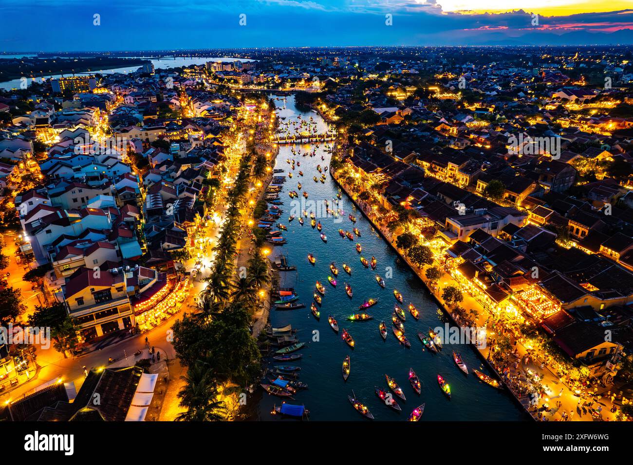 Aerial view of Hoi An Ancient Town with lantern boats on Hoai river, in ...