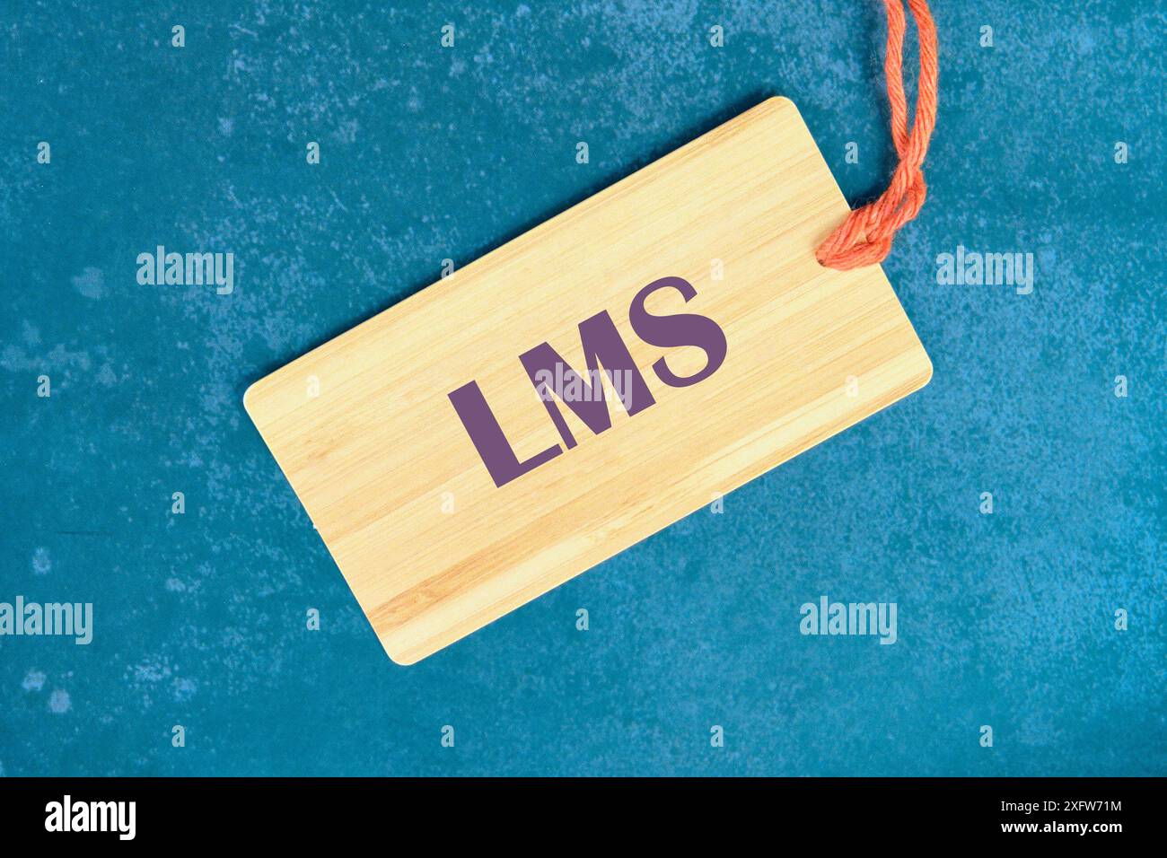 LMS - Learning Management System acronym. LMS on a card with a string ...