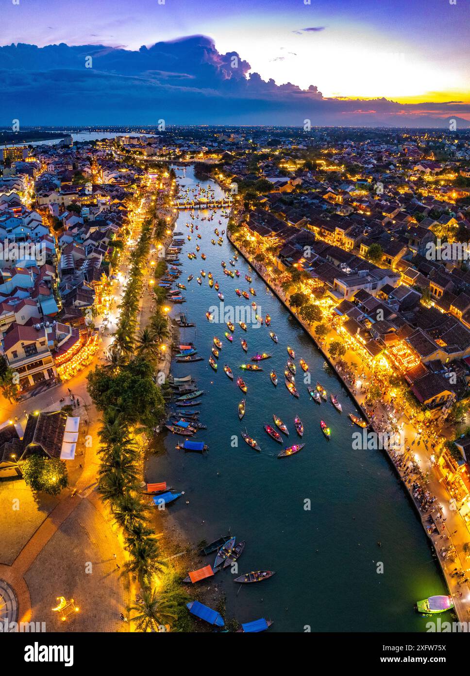 Aerial view of Hoi An Ancient Town with lantern boats on Hoai river, in ...