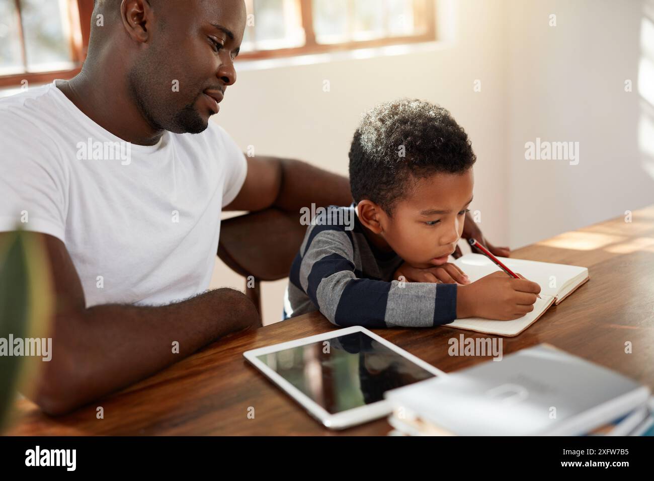 Homework, support and dad with child and writing help in family home ...