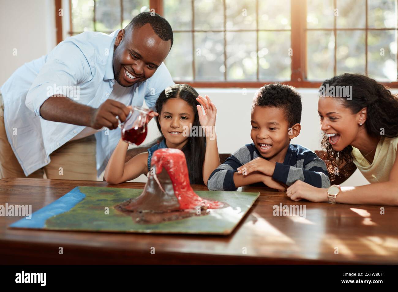 Science, parents and kids with volcano in home for school project with ...