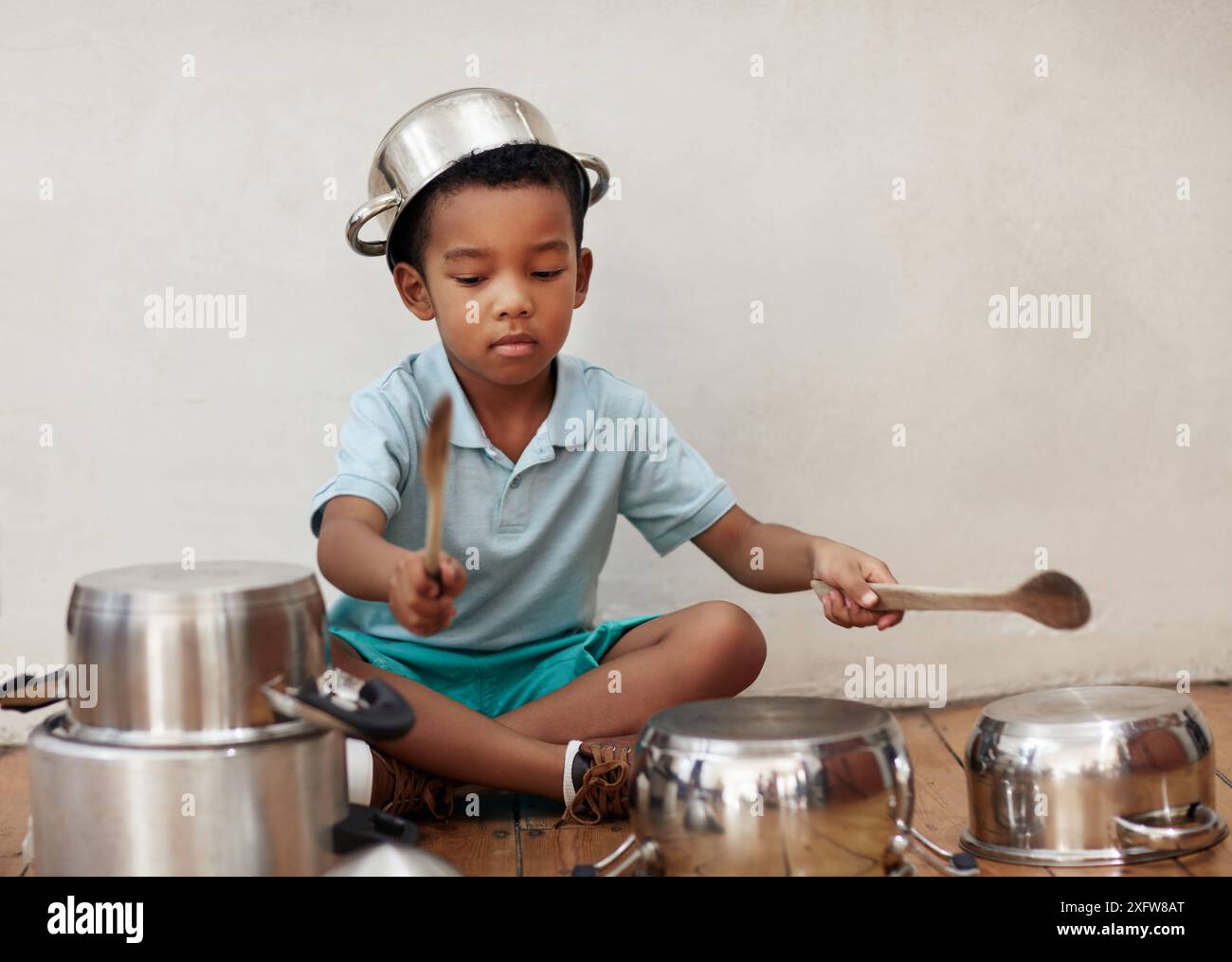 Child playing drum pot pan hi-res stock photography and images - Alamy