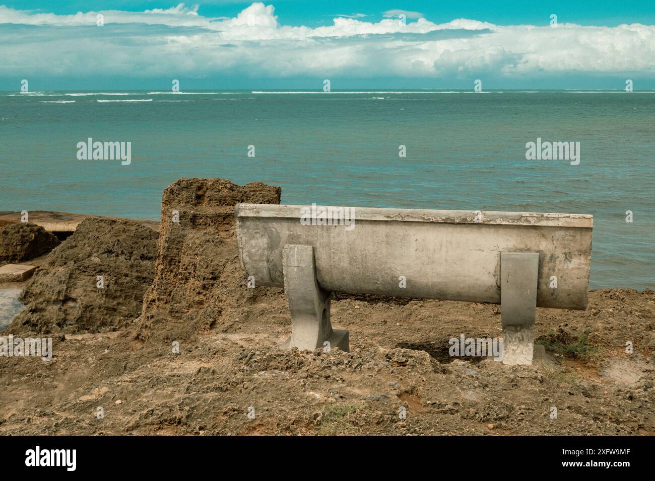 Concrete chairs facing the ocean at The Vasco Da Gama Pillar - A ...