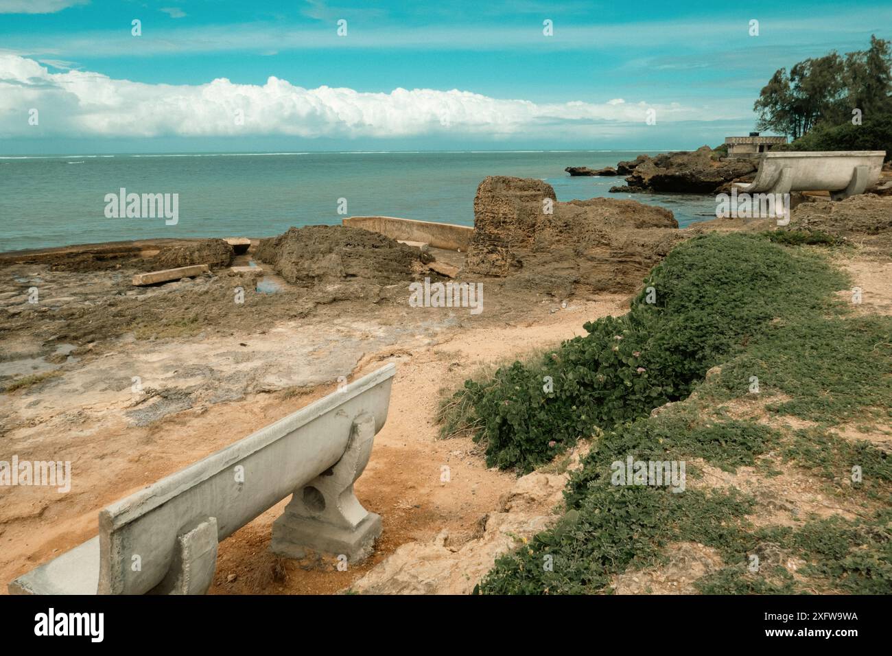 Concrete chairs facing the ocean at The Vasco Da Gama Pillar - A ...