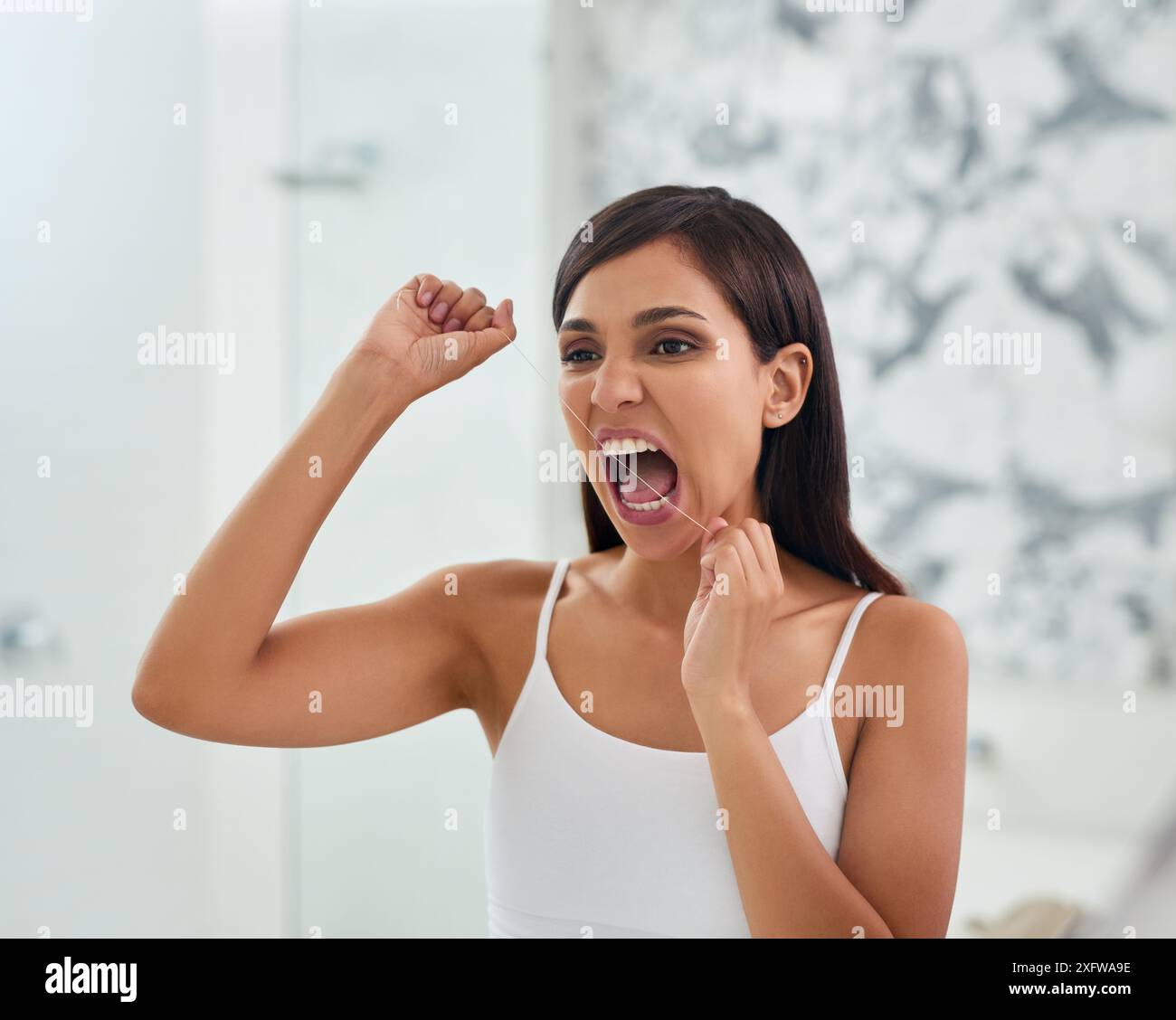 Woman, dental routine and flossing teeth in home, orthodontics and ...