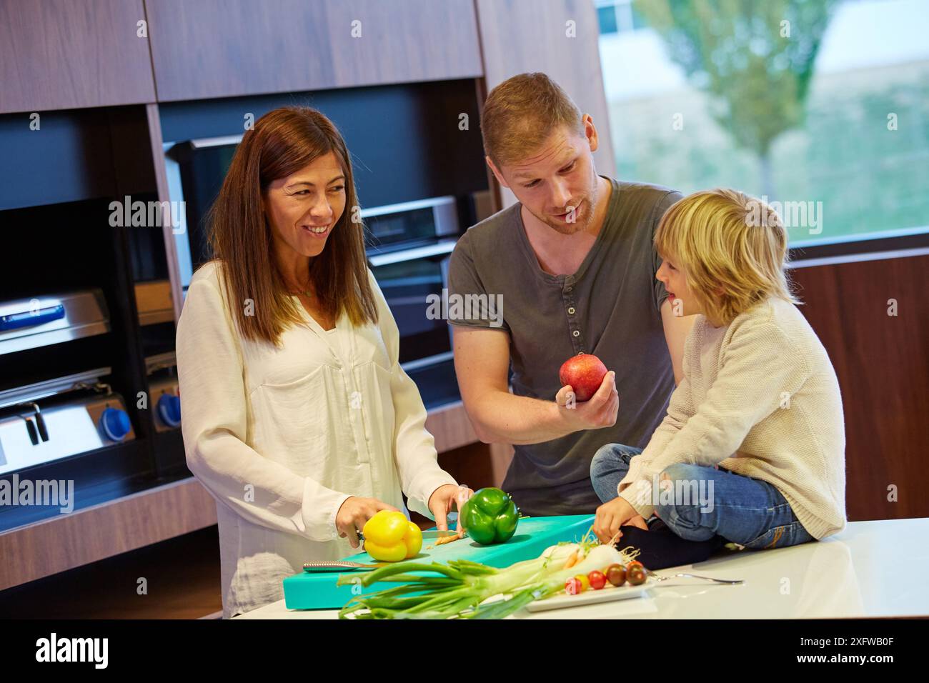 Family in the kitchen. Parents and son. Healthy eating. Healthy growth ...