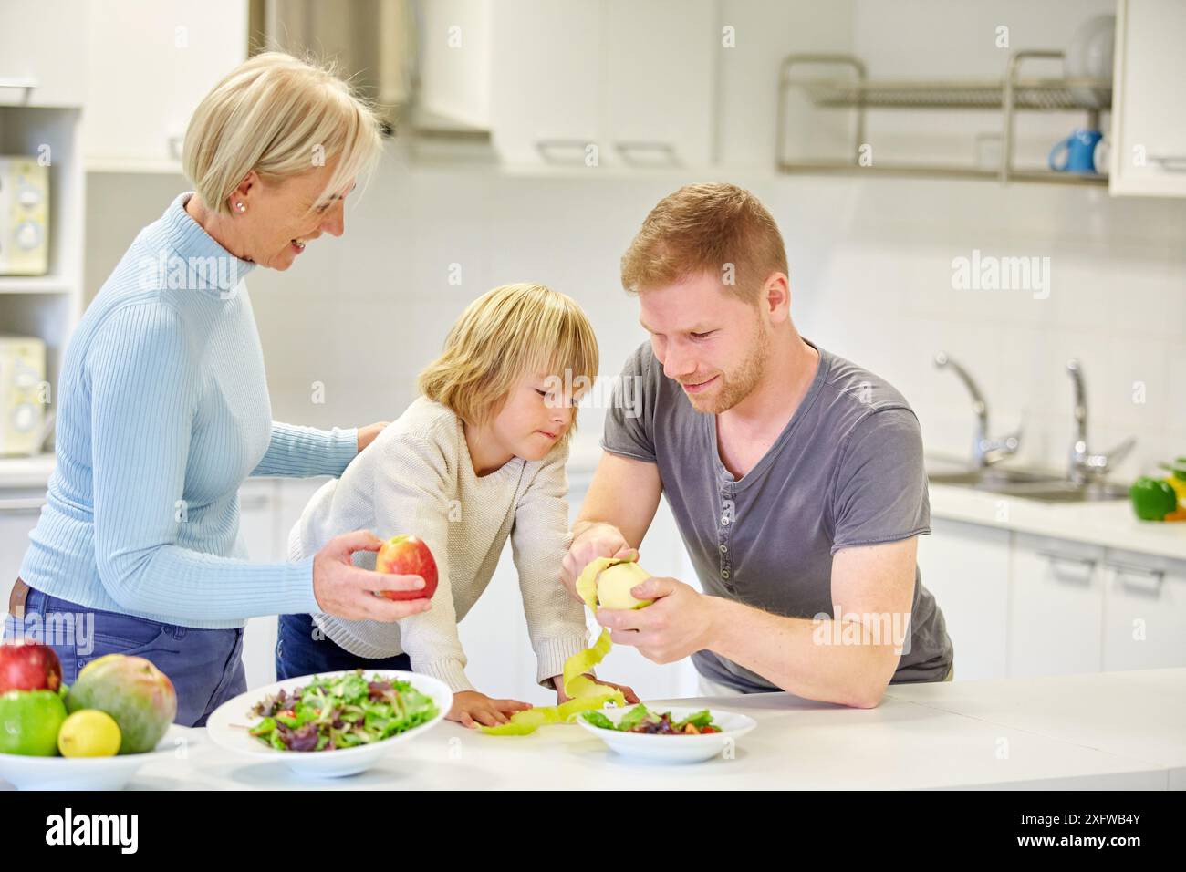 Family in the kitchen. Three generations. Healthy eating. Healthy ...