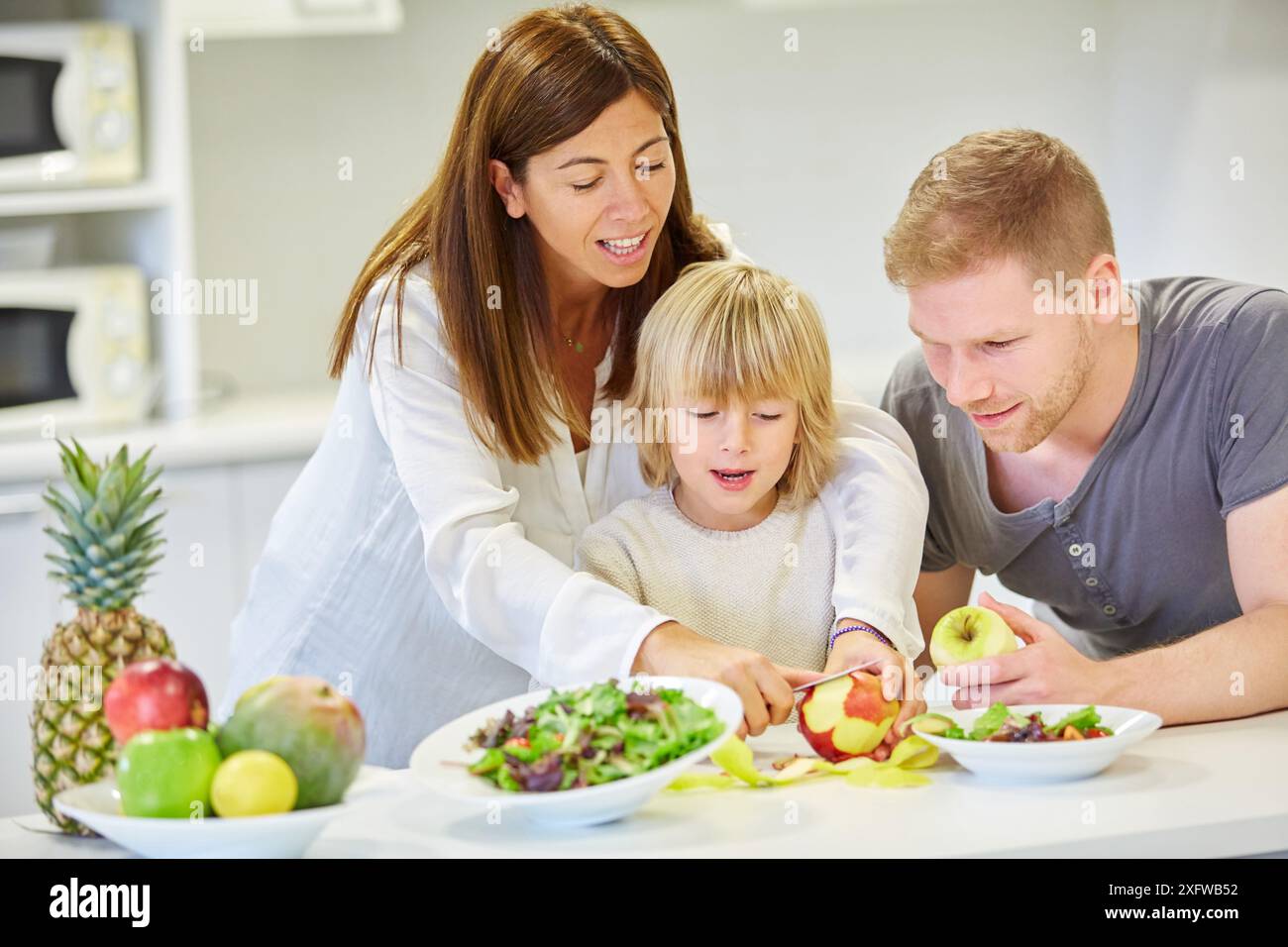 Family in the kitchen. Parents and son. Healthy eating. Healthy growth ...