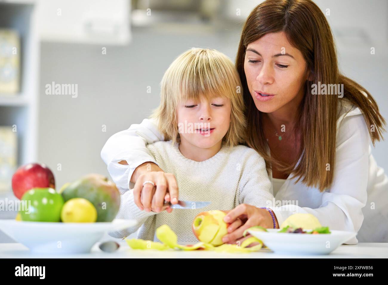 Family in the kitchen. Mother and son. Healthy eating. Healthy growth ...