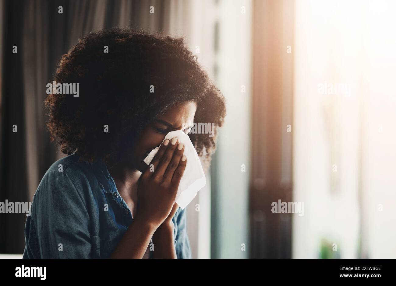 Black woman, sick and sneeze with tissue for allergy season, sinus ...