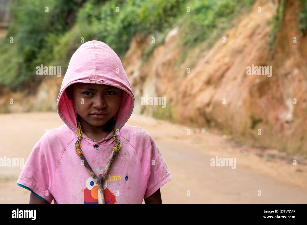 Child with a catapult, probably to hunt birds, Andasibe village ...