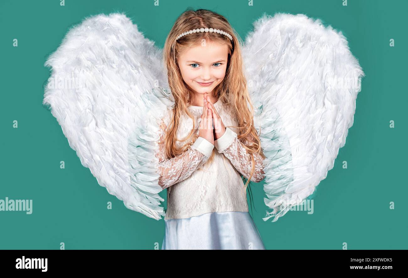 Child with angelic face. Cute child girl posing with angel wings ...