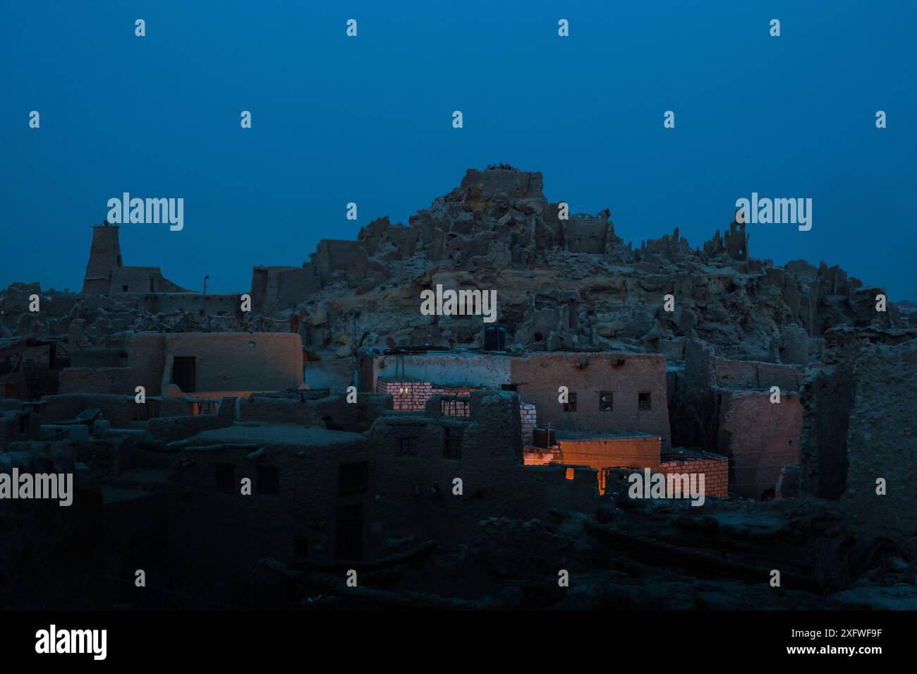 View of the mud brick houses at night inside the ancient fortress of ...