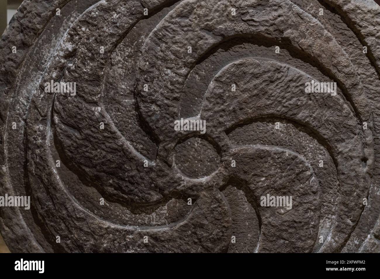 five-armed swastika in relief, second Lombera stele, giant disc-shaped ...