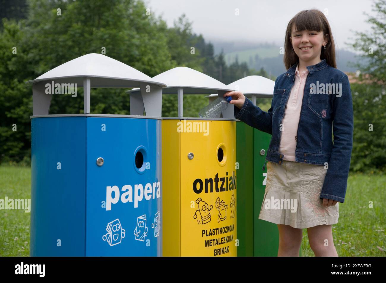 Girl by recycling containers. Legazpi, Guipuzcoa, Euskadi, Spain Stock ...