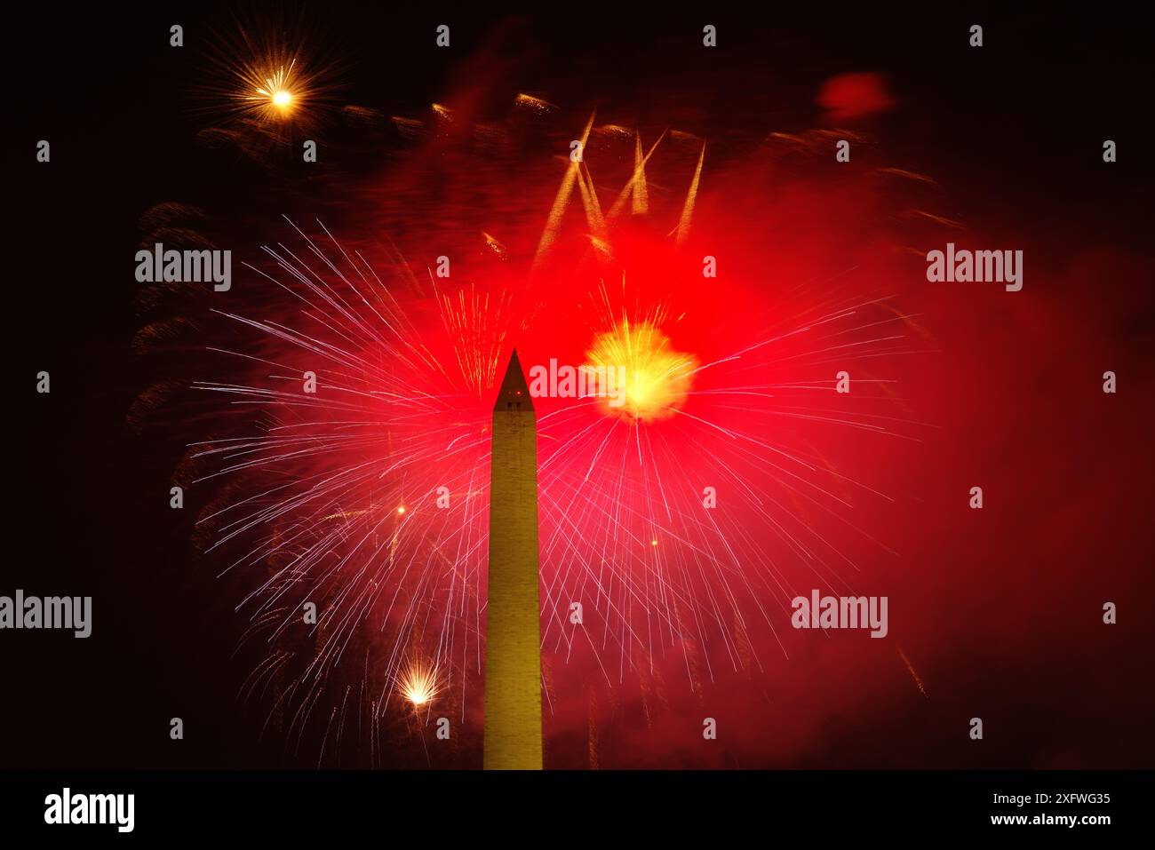 Independence Day fireworks light up the sky behind the Washington ...