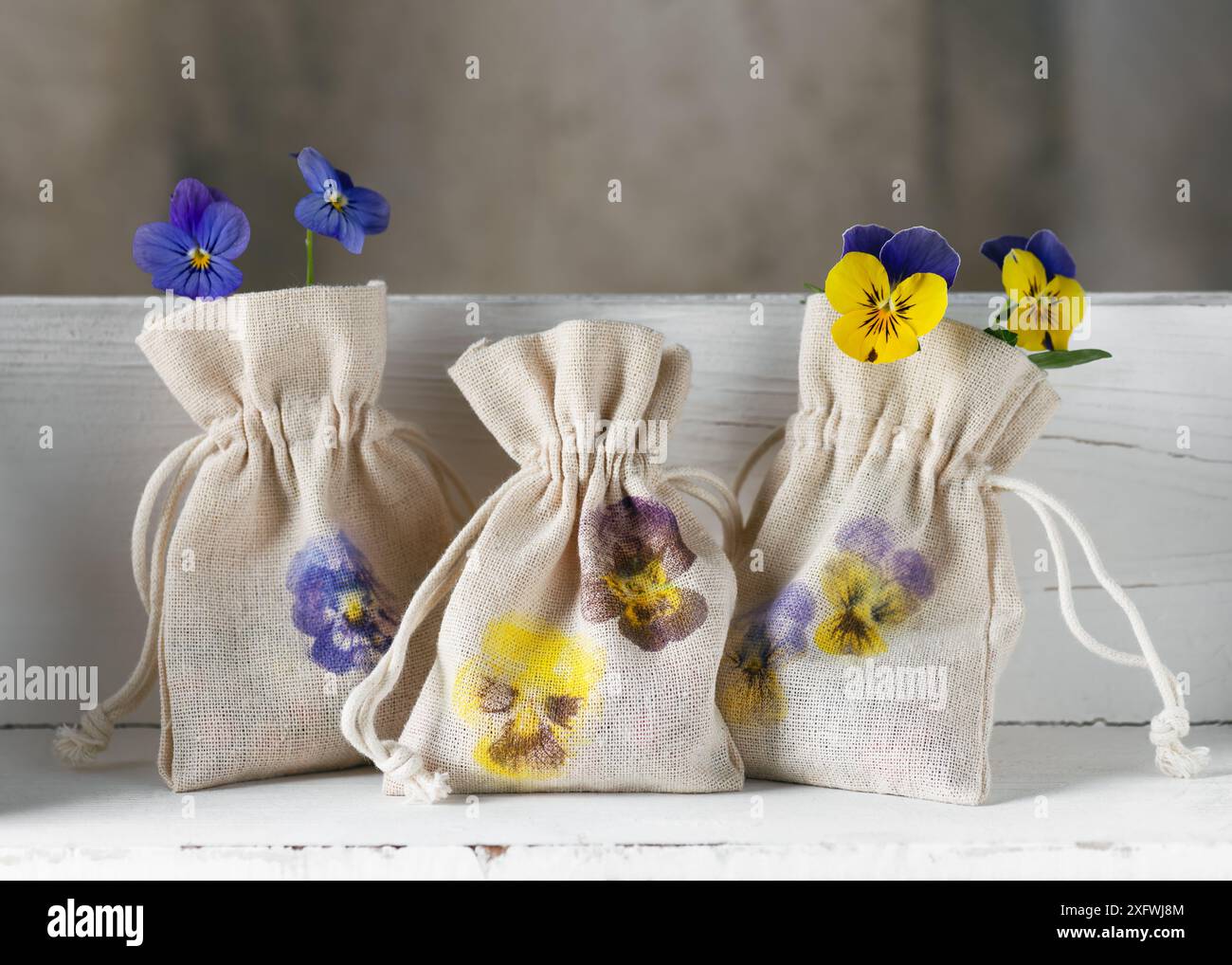 Three small handmade fabric bags with beautiful hammered pansy flower ...