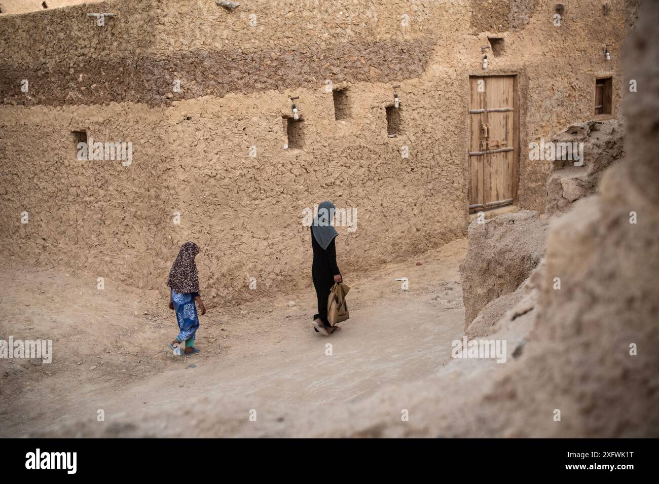 Siwa, Egypt. 15th Apr, 2018. A woman and child walk through the ...