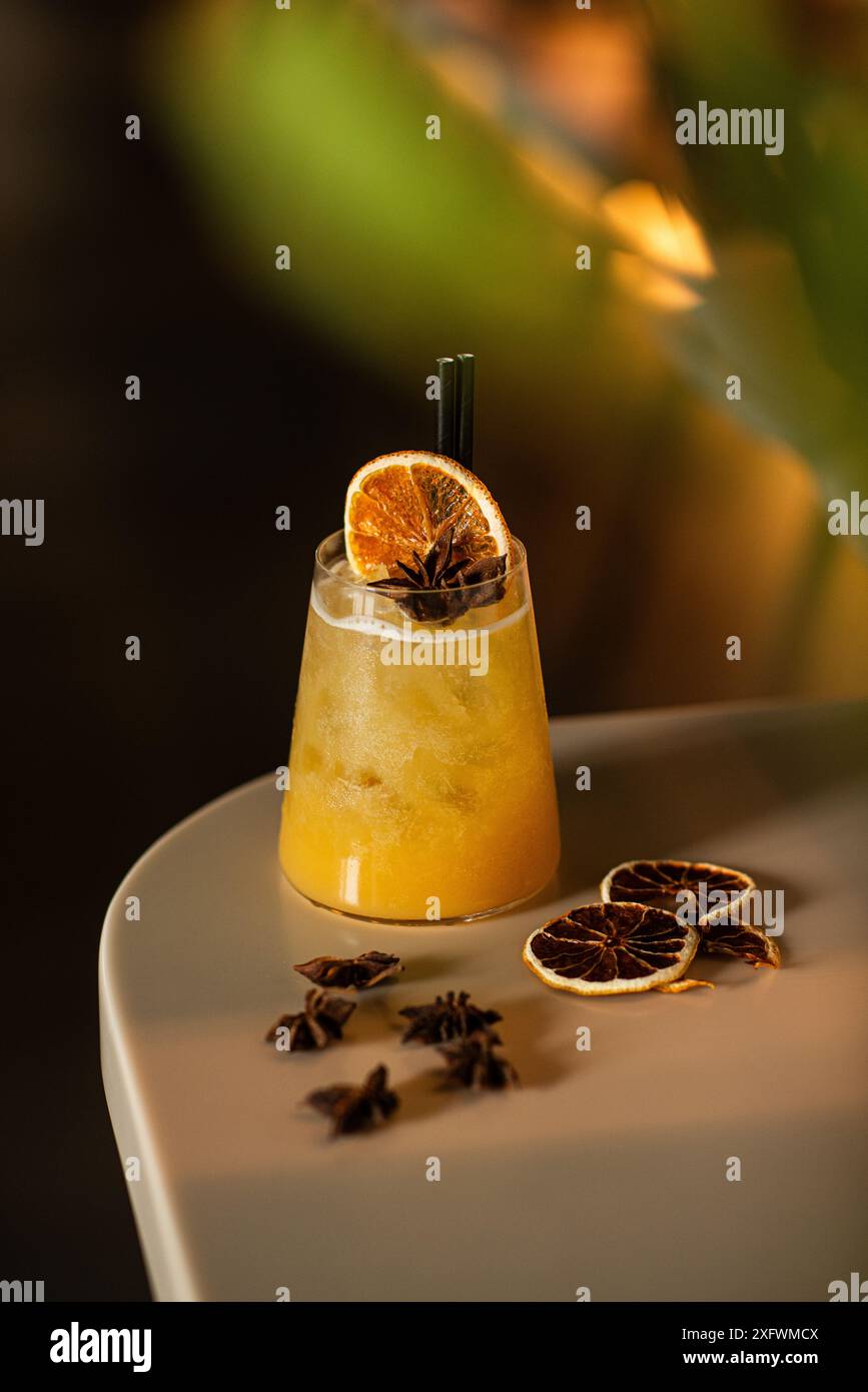 Summer drink cocktail. Orange cinnamon iced drink Stock Photo - Alamy