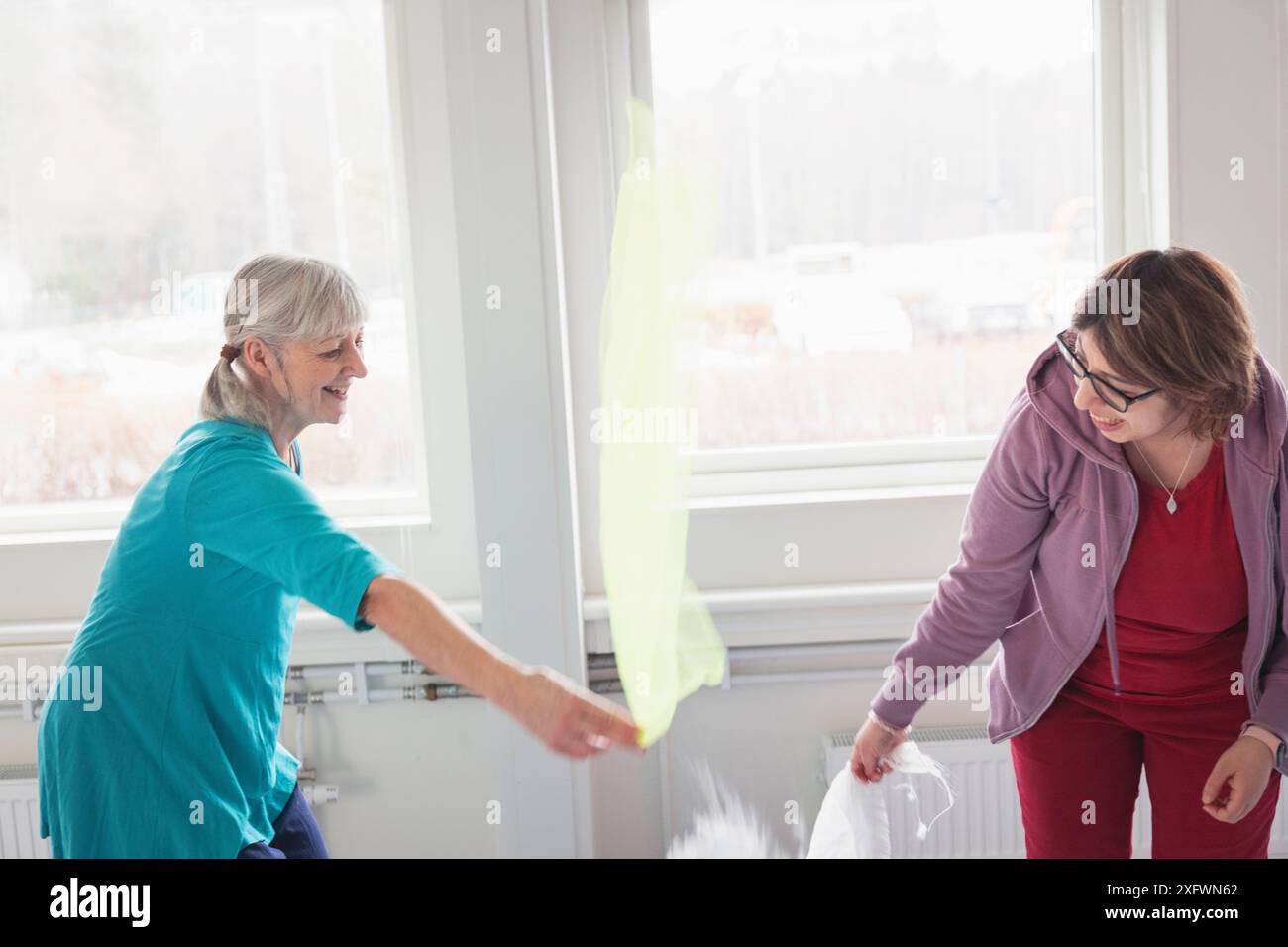 Female instructor dancing with student at dance studio Stock Photo - Alamy