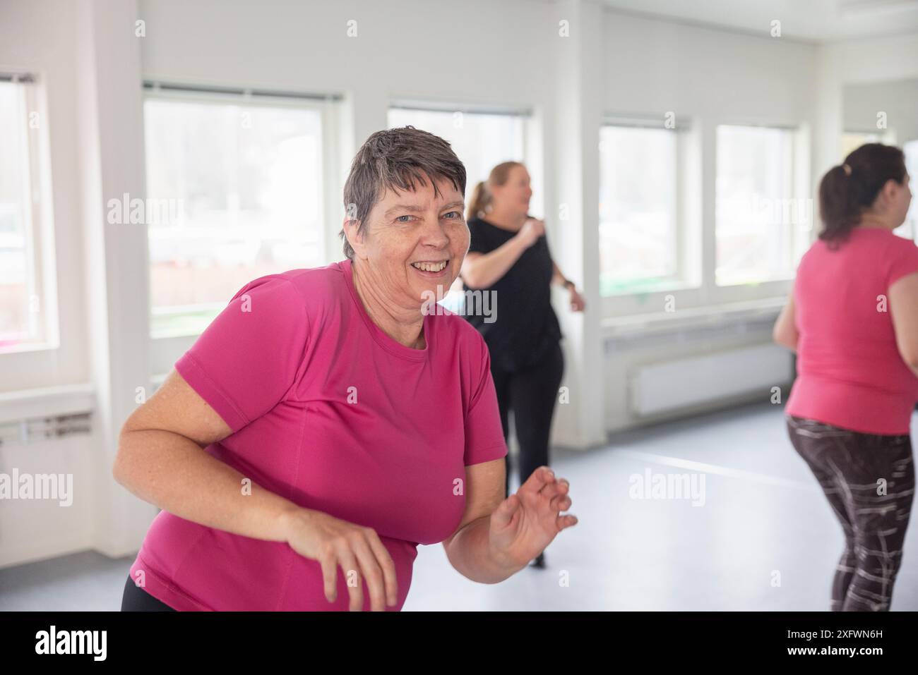 Smiling woman dancing at dance studio Stock Photo - Alamy