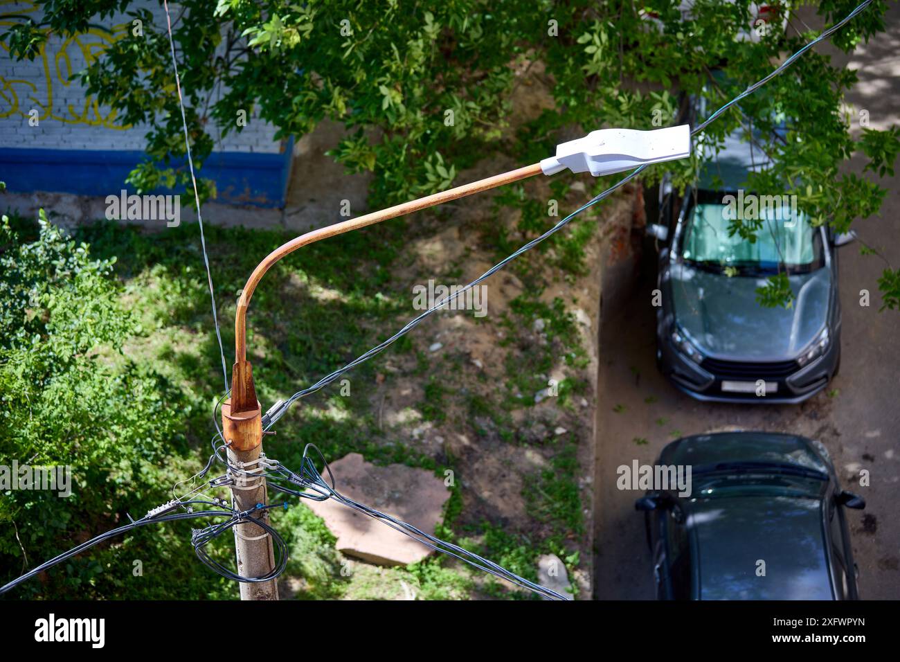 Electric wire cable on street lamp post at sunny day, horizontal, top ...