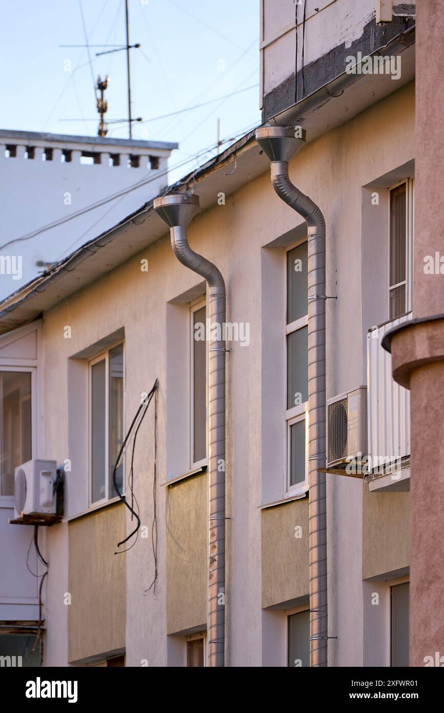 2 Drain pipe from the roof on the wall of the building, vertical Stock ...
