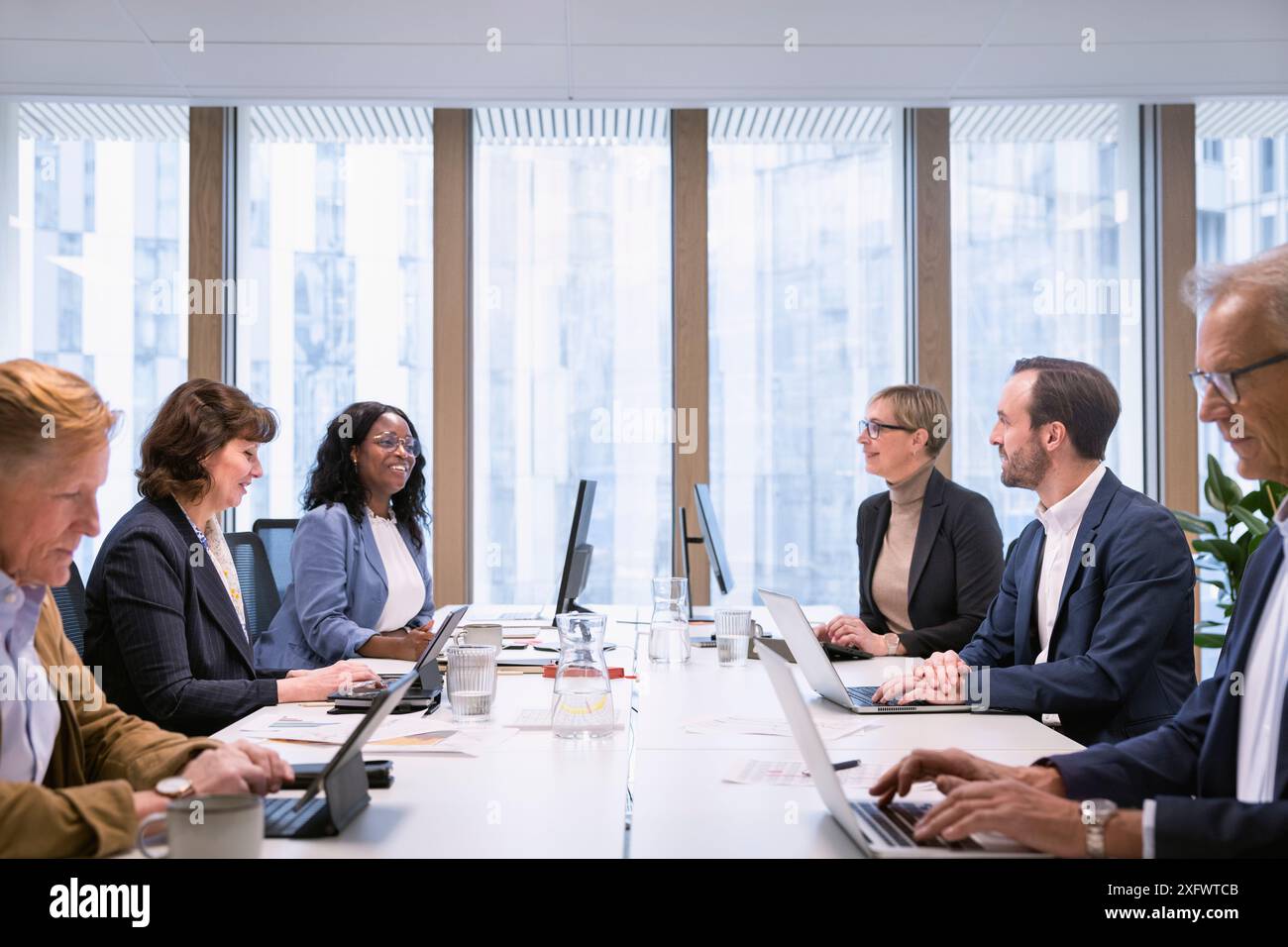 Group of multiracial business people discussing ideas over conference ...