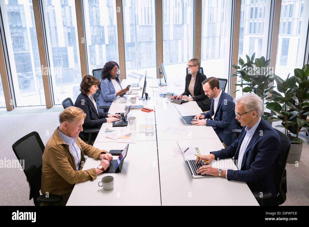 Multiracial corporate colleagues working in office Stock Photo - Alamy