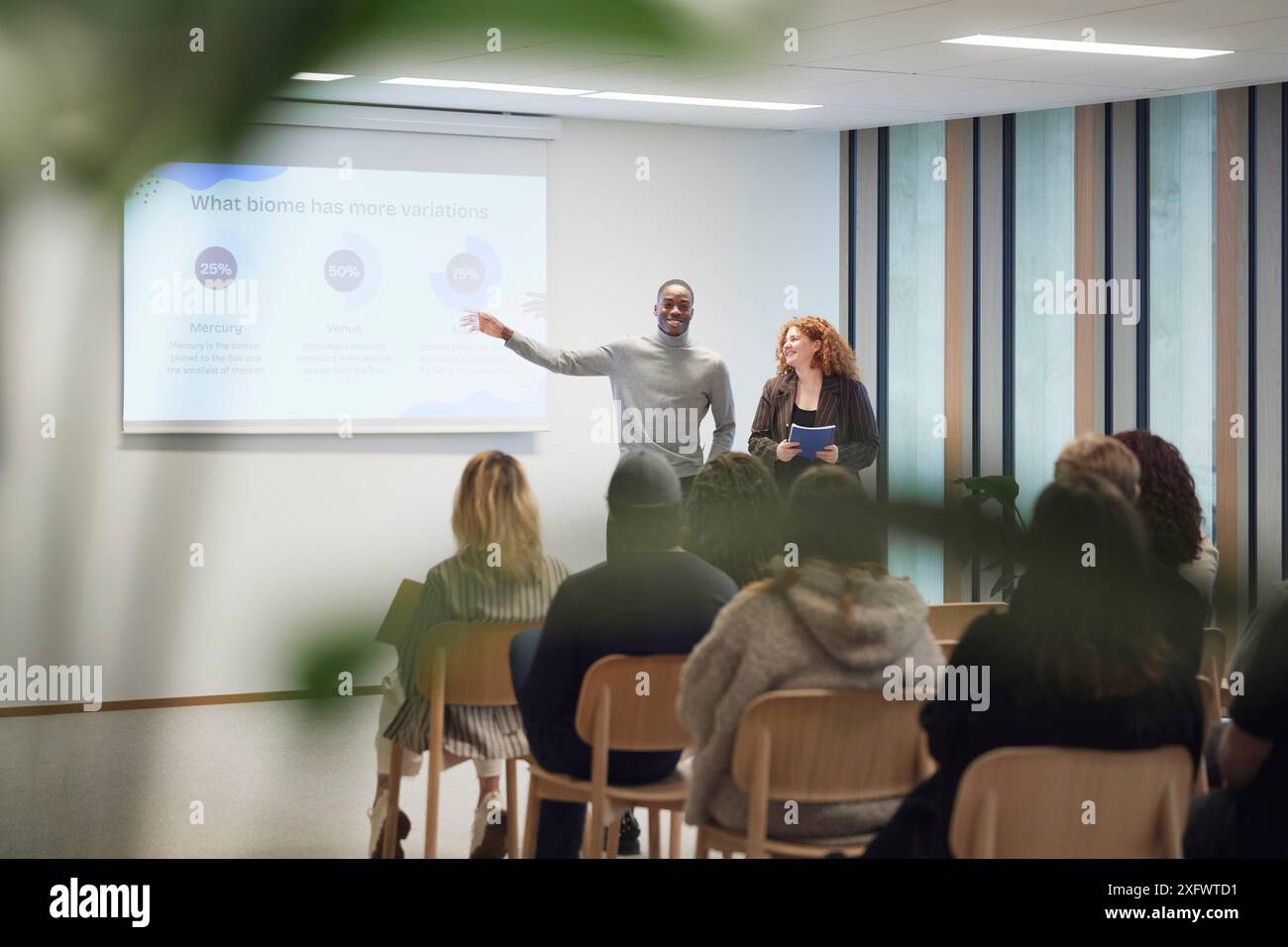 Multiracial business people giving presentation during meeting in ...