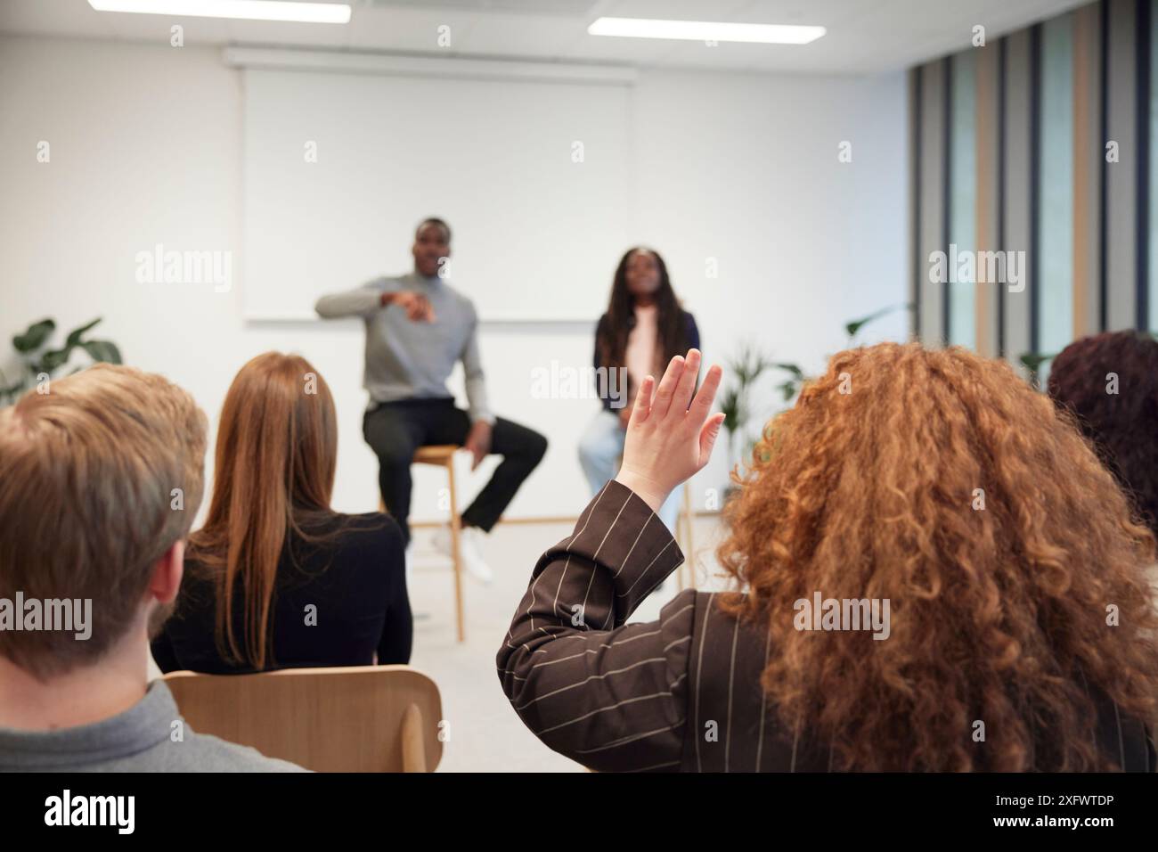 Business person raising hand meeting hi-res stock photography and ...