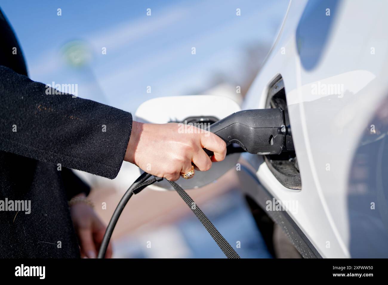 Female refilling fuel storage tank Stock Photo - Alamy