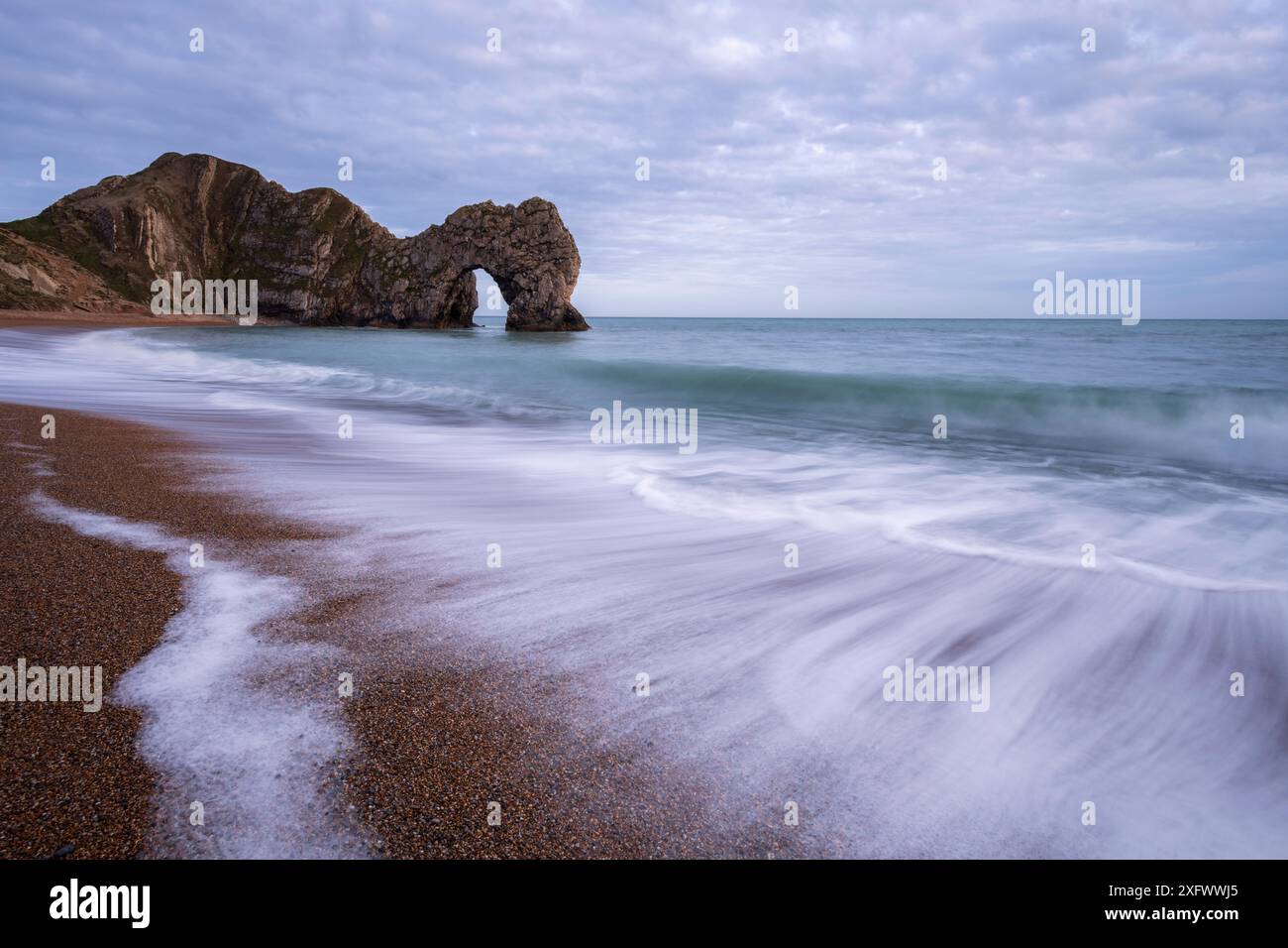 Durdle Door rock arch at high tide, Nr Lulworh Cove, Dorset, UK. April ...