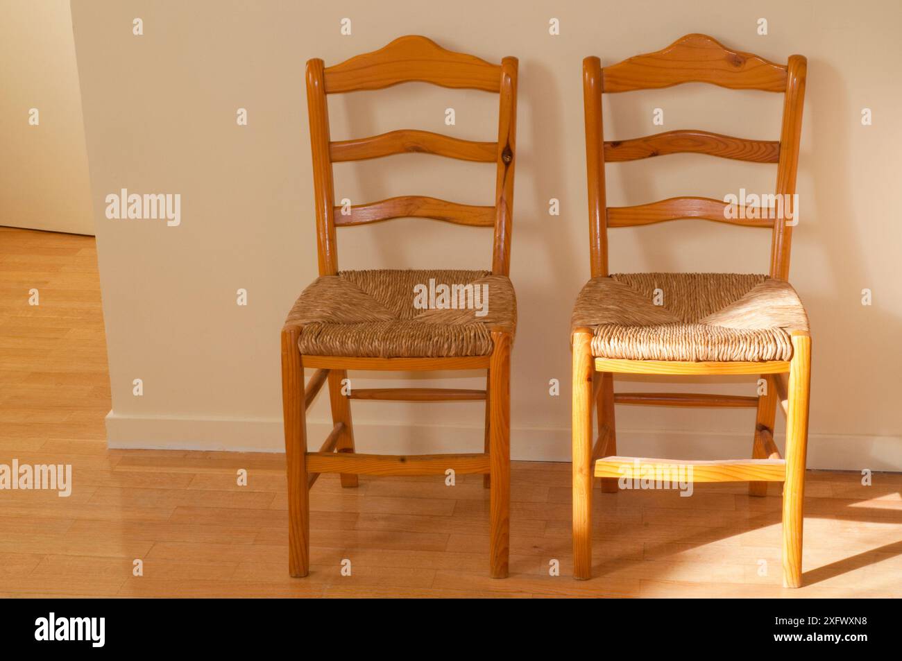 Two wooden chairs, with wickerwork seats Stock Photo - Alamy