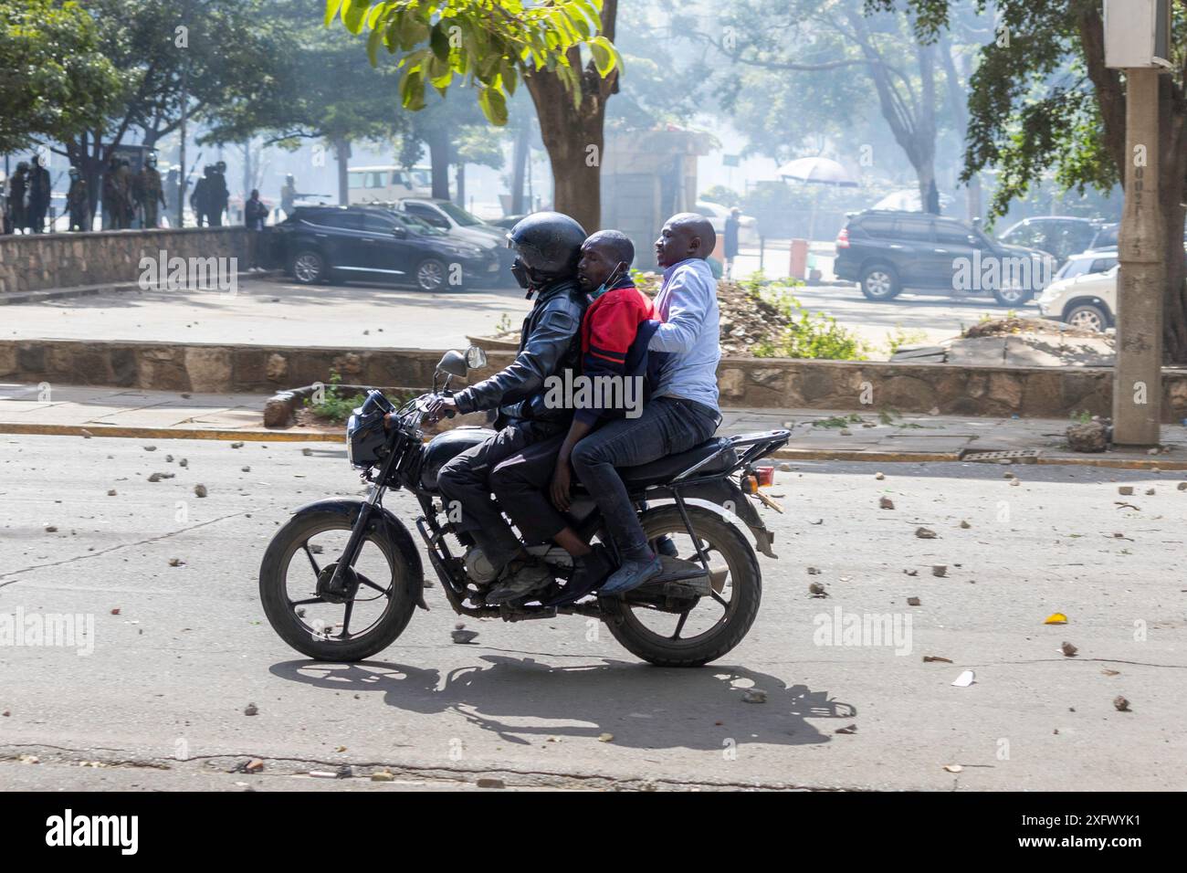 Nairobi, Kenya - June 25th, 2024. An injured protester is transported ...
