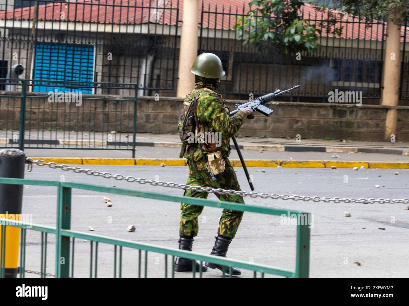 Nairobi, Kenya - June 25th, 2024. Police officer fires live rounds at ...