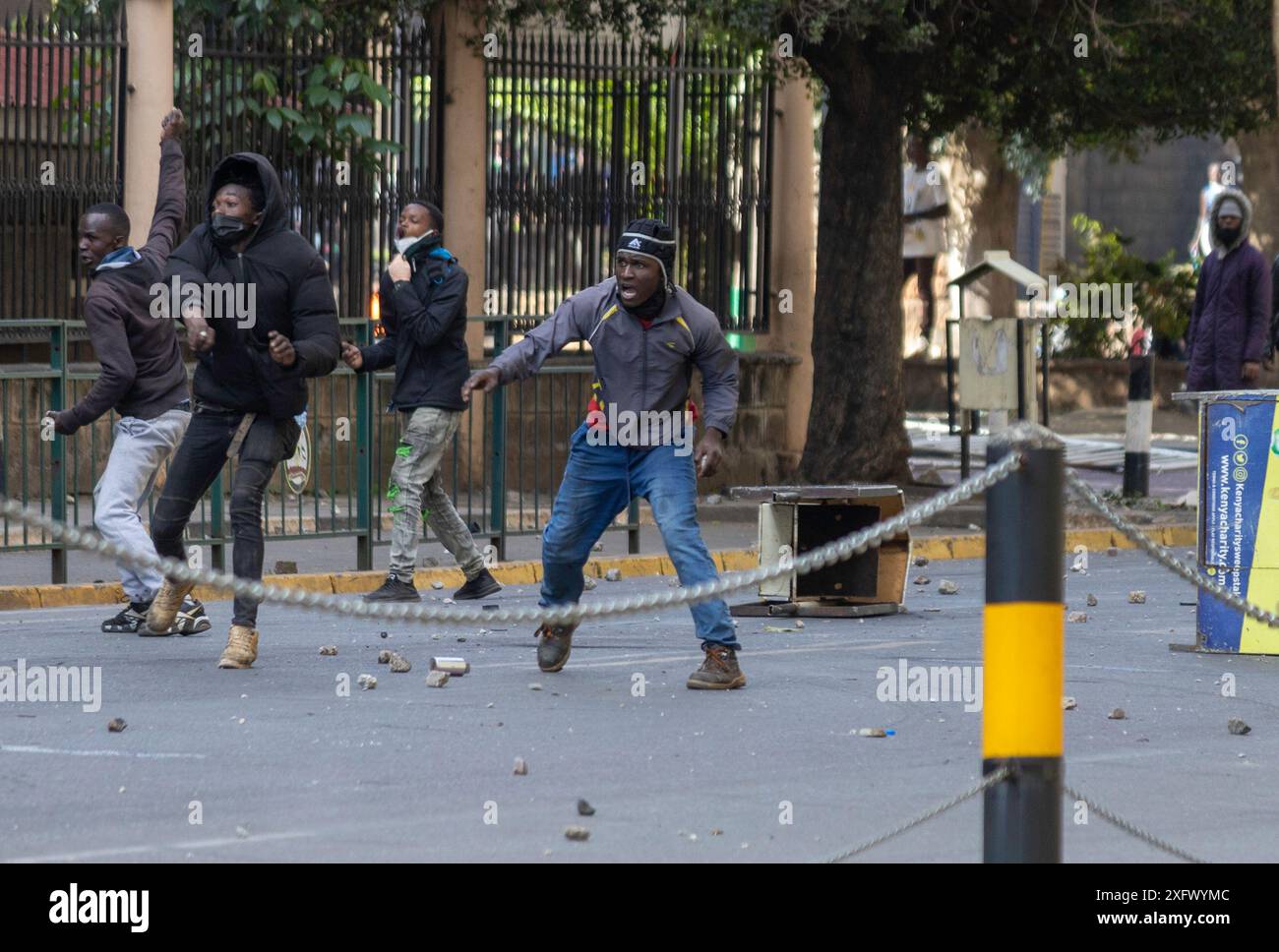 Nairobi, Kenya - June 25th, 2024. Protesters thow stones and other ...
