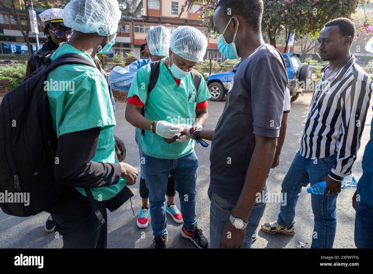 Nairobi, Kenya - June 25th, 2024. Medical officers administer first aid ...