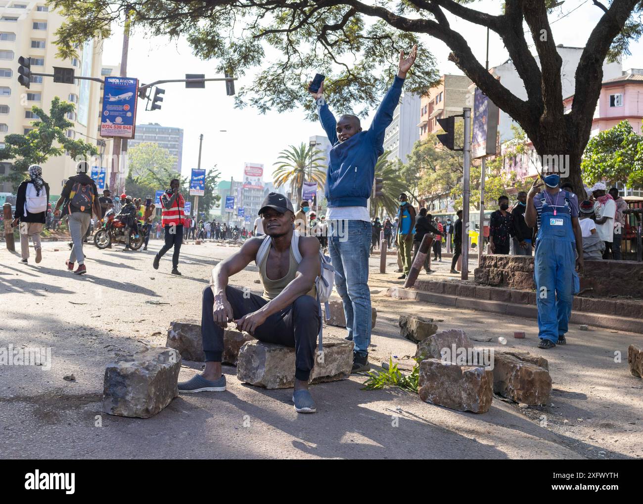 Nairobi, Kenya - June 25th, 2024. Protesters pose in the street after ...