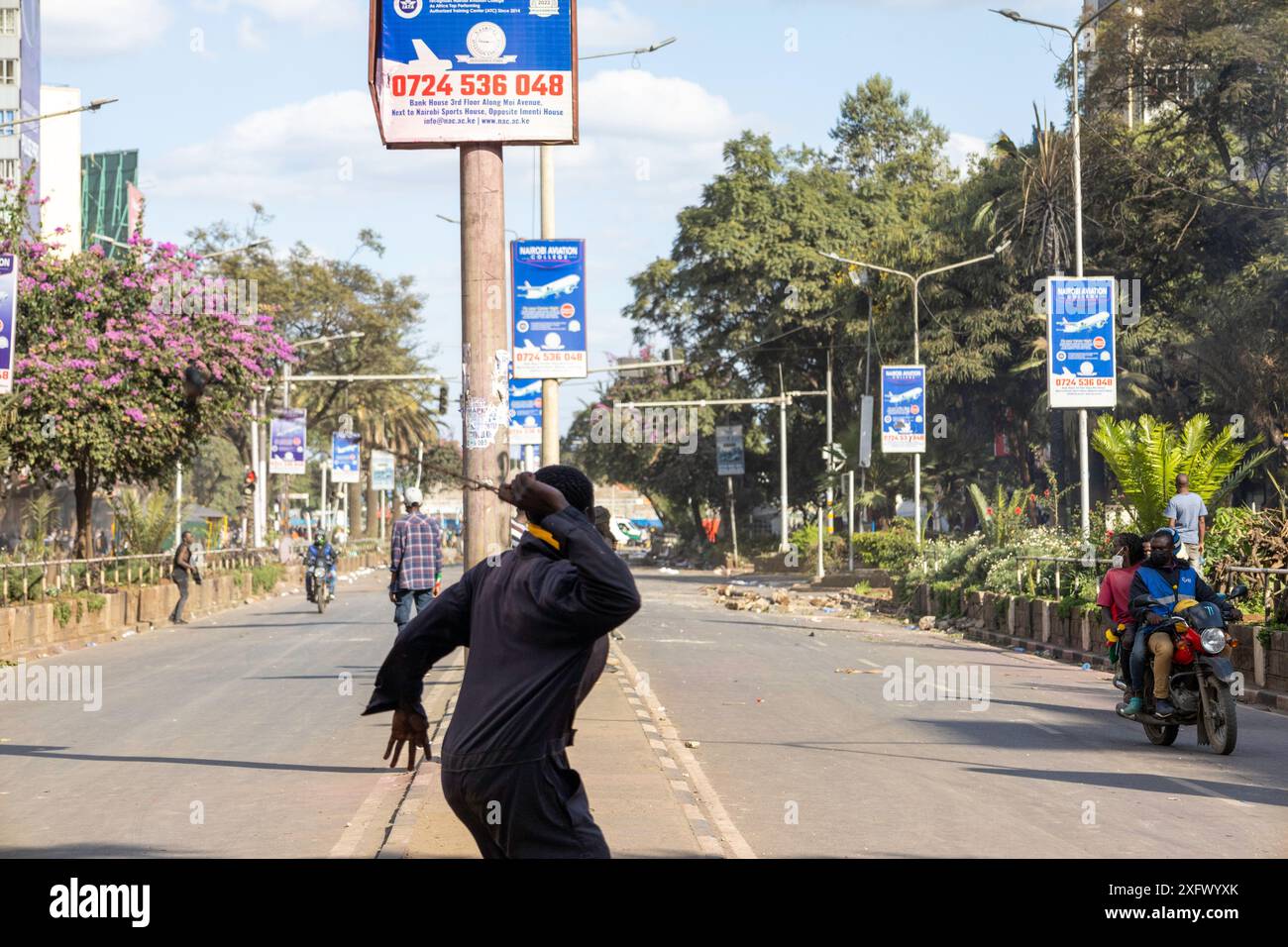 Nairobi, Kenya - June 25th, 2024. Protesters thow stones and other ...