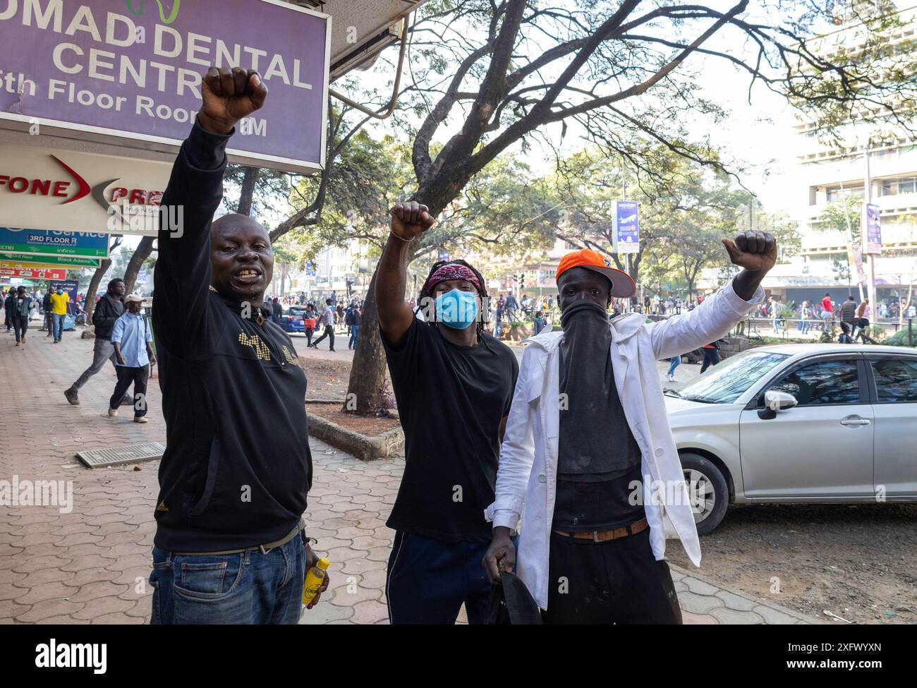 Nairobi, Kenya - June 25th, 2024. Protesters pose in the street after ...