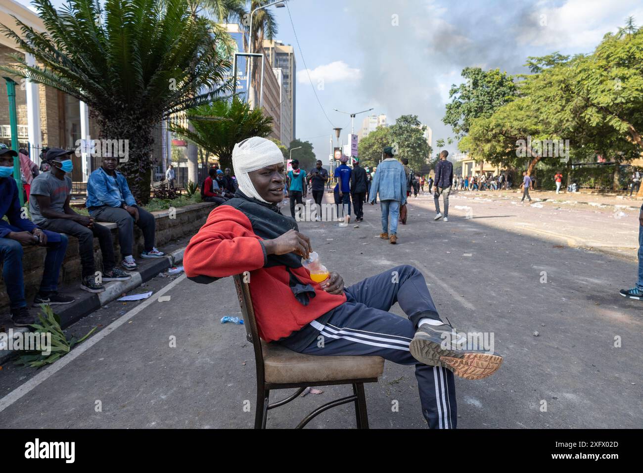 Nairobi, Kenya - June 25th, 2024. An injured protester with a heavily ...