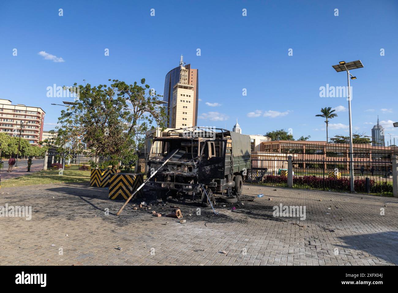 Nairobi, Kenya - June 25th, 2024. Burnt shell of a police truck outside ...