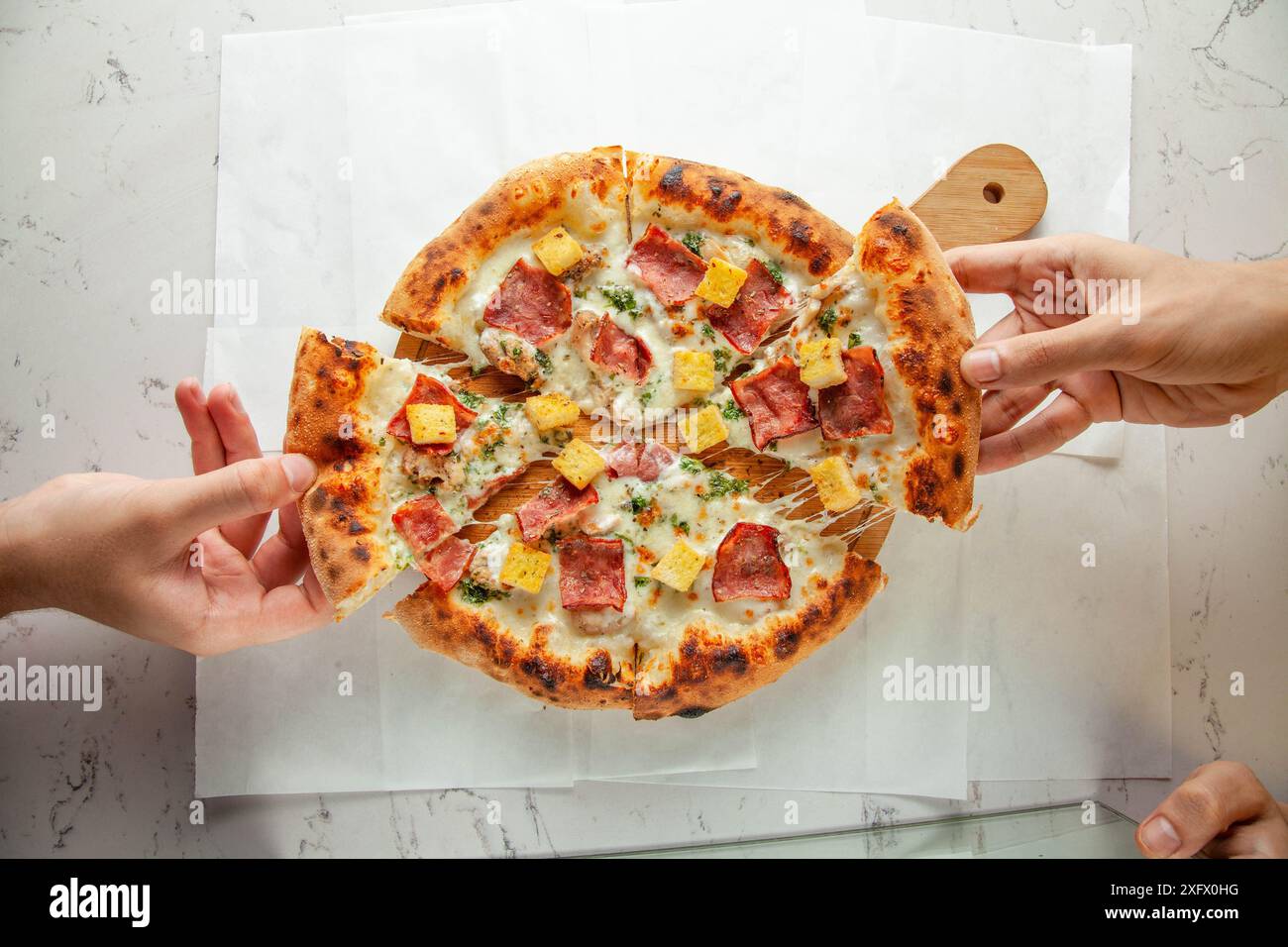 caesar salad flavoured styled neapolitan pizza lifestyle with people eating Stock Photo - Alamy