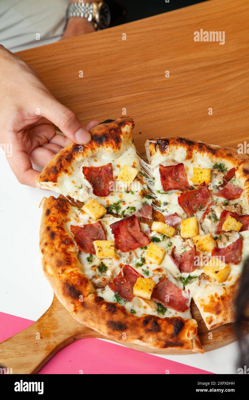 caesar salad flavoured styled neapolitan pizza lifestyle with people ...