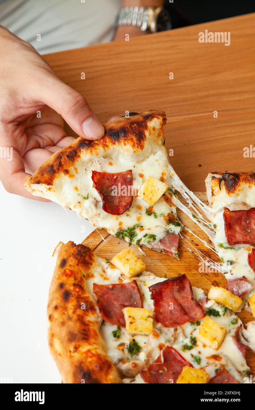 caesar salad flavoured styled neapolitan pizza lifestyle with people ...