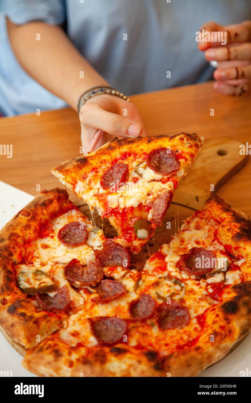 Naples authentic brick oven pizza, pepperoni flavour Stock Photo - Alamy