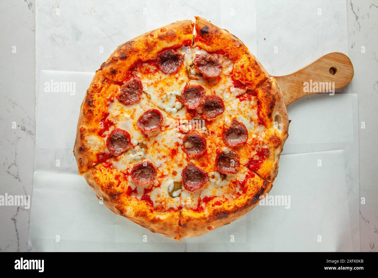 Naples authentic brick oven pizza, pepperoni flavour Stock Photo - Alamy