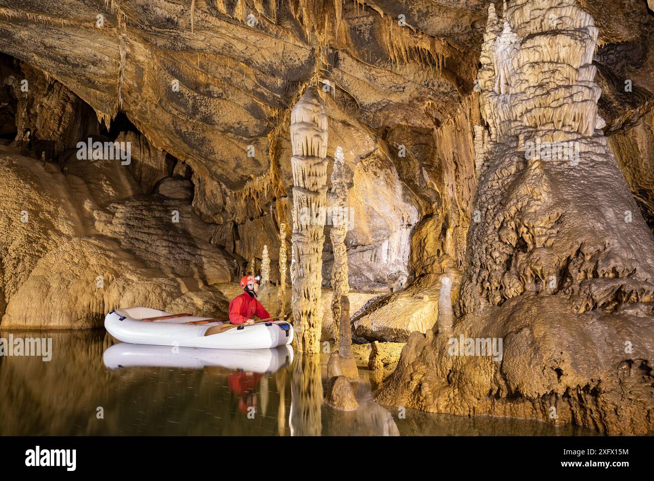 Man in zodiac looking at stalactites and stalagmites at Venice Pier ...