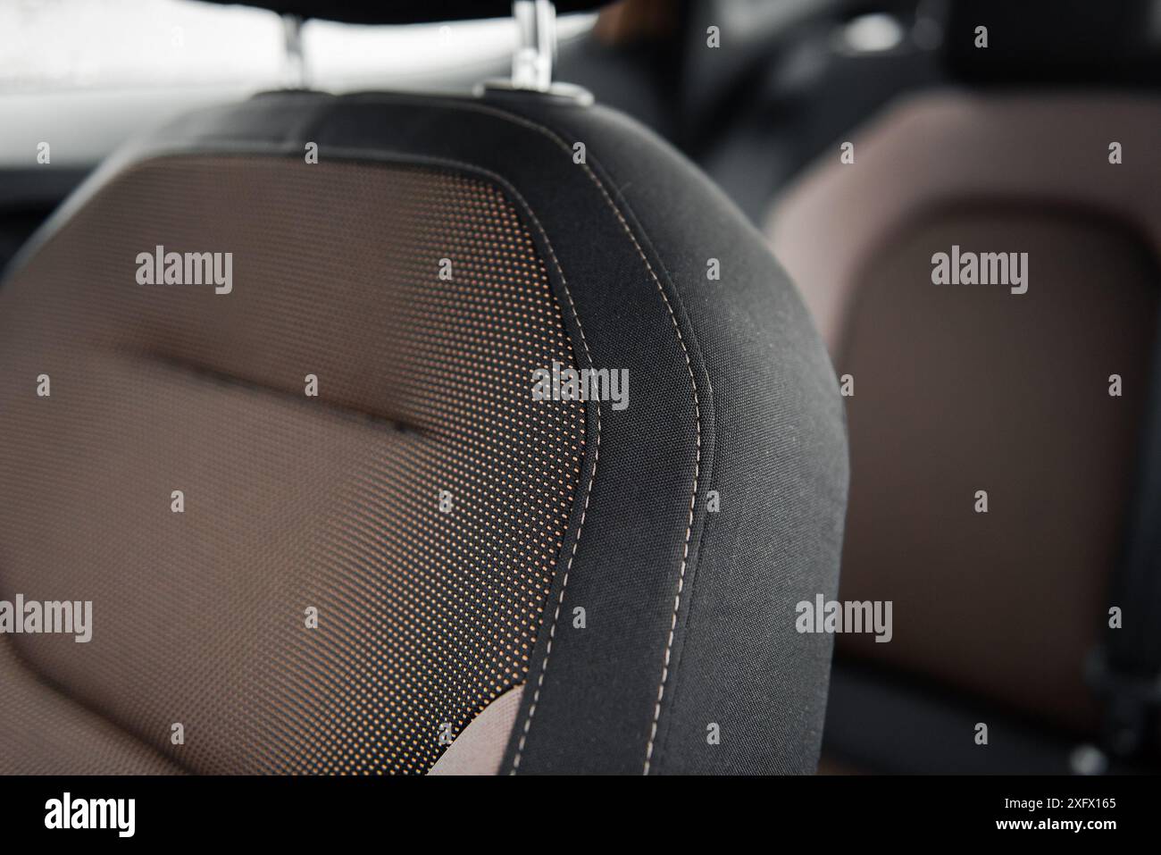 Car interior seats with beige trim - close-up image. Front cloth seat ...